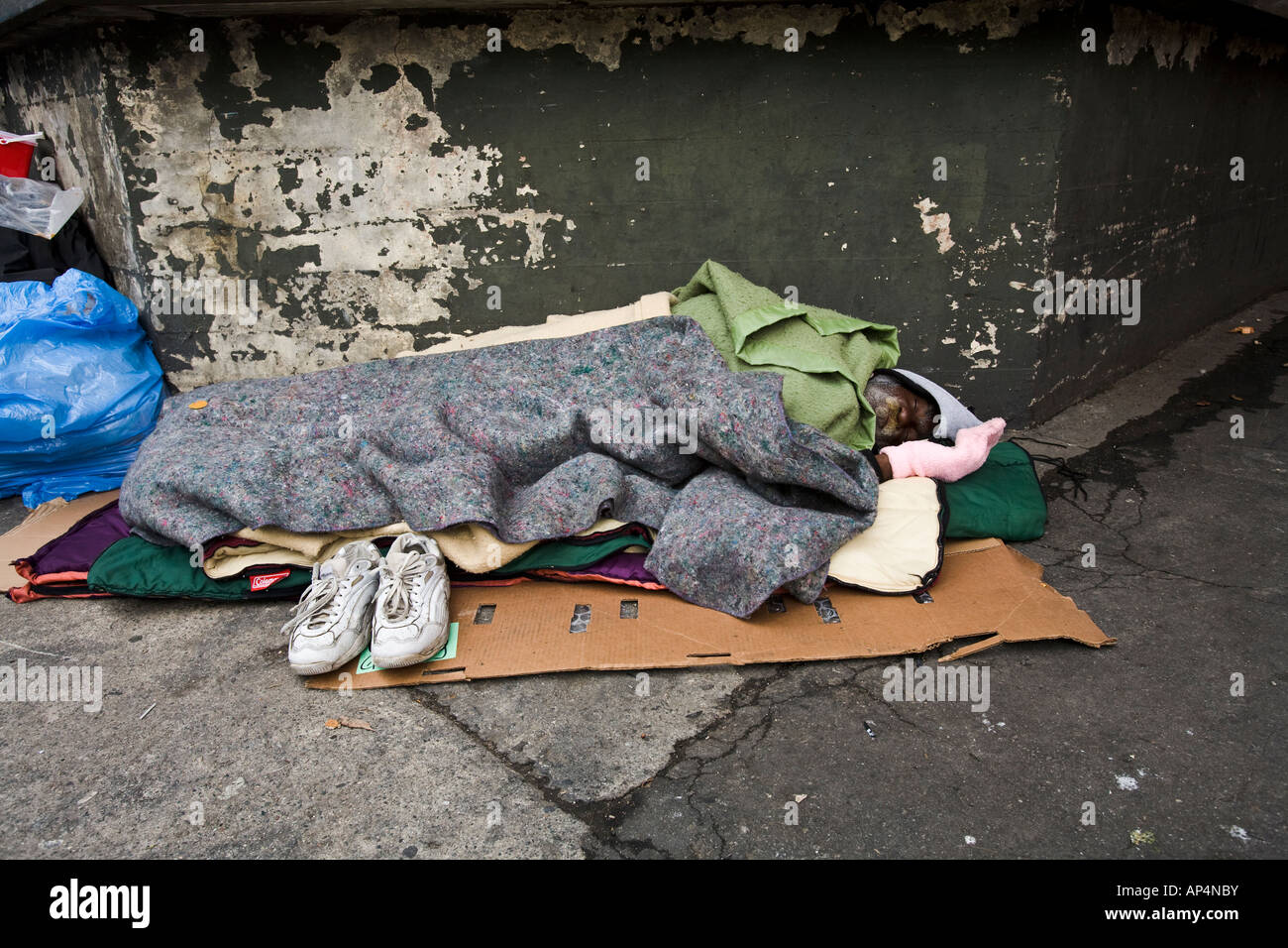 A homeless man sleeps in downtown Los Angeles California United States ...