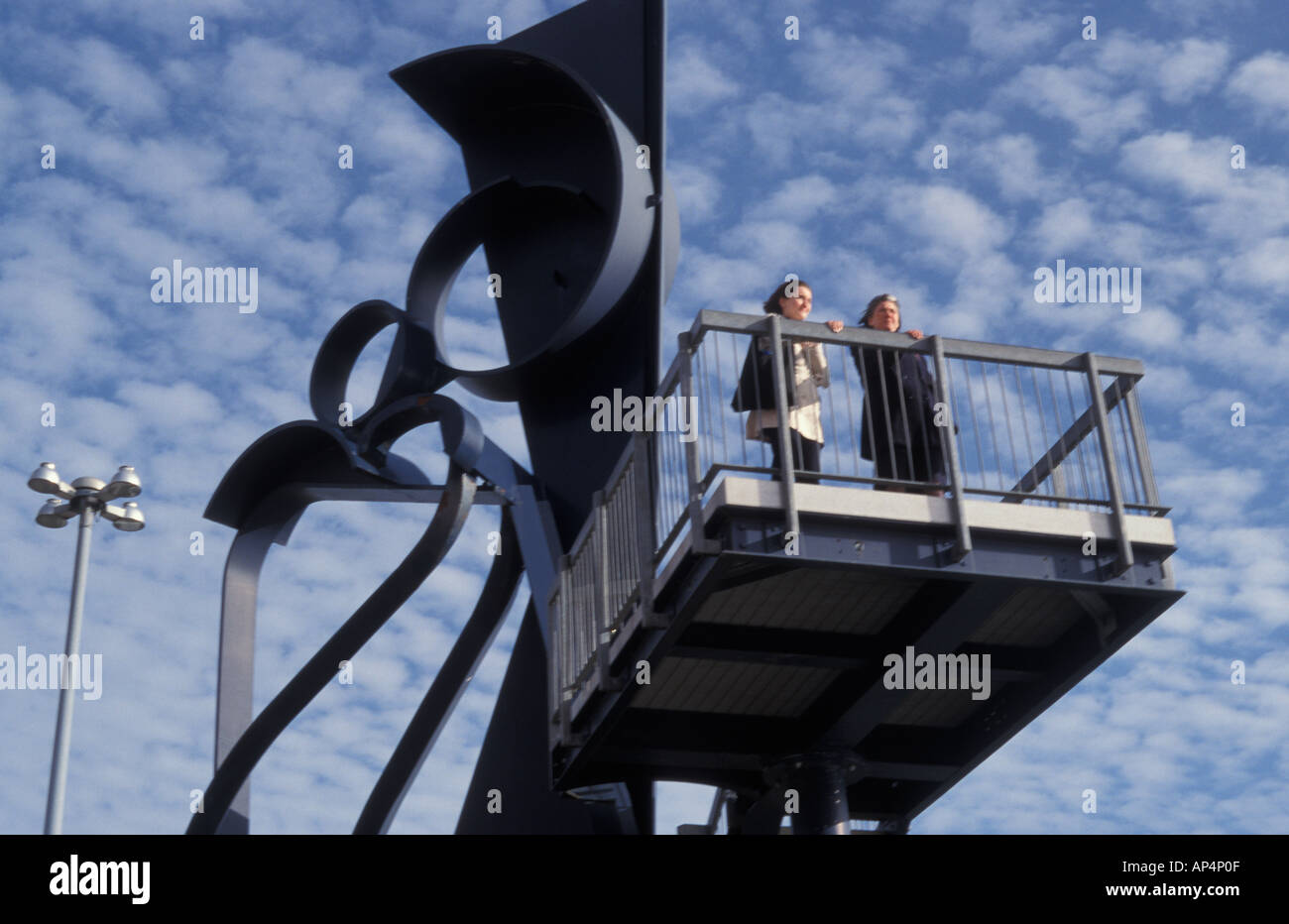 Two women looking out at the sea on the observation platform in Poole ...