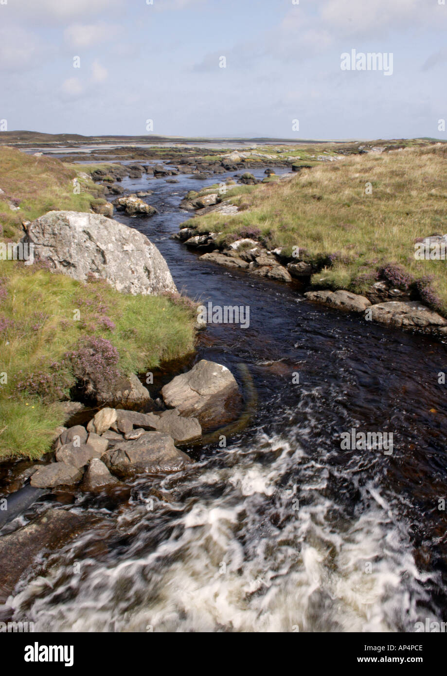 Water running in to the loch Stock Photo - Alamy