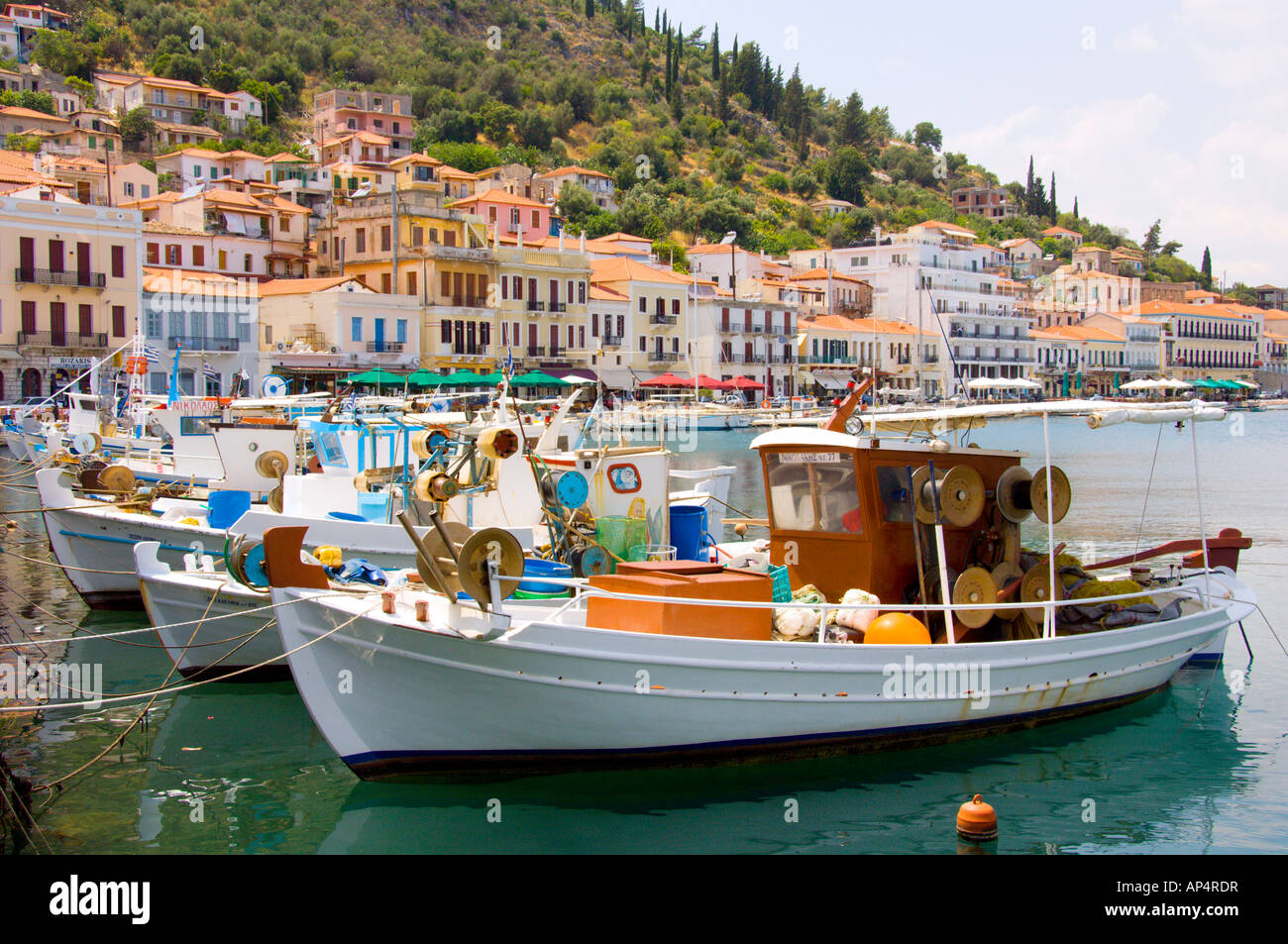 Pastel colored buildings on the waterfront and colorful fishing boats ...