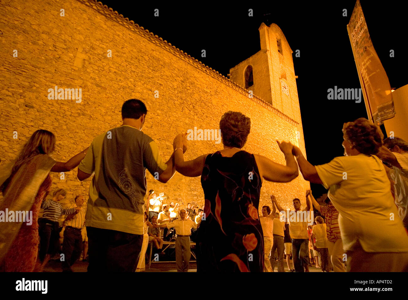 Catalan Sardana dance being performed at night in the town of Begur on ...