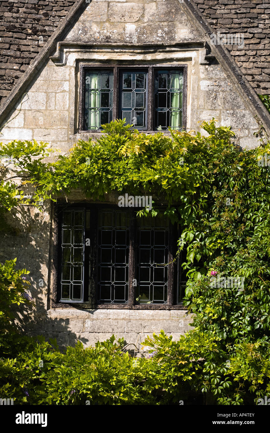 Profile of a gabled Cotswold stone building with leaded glass windows ...