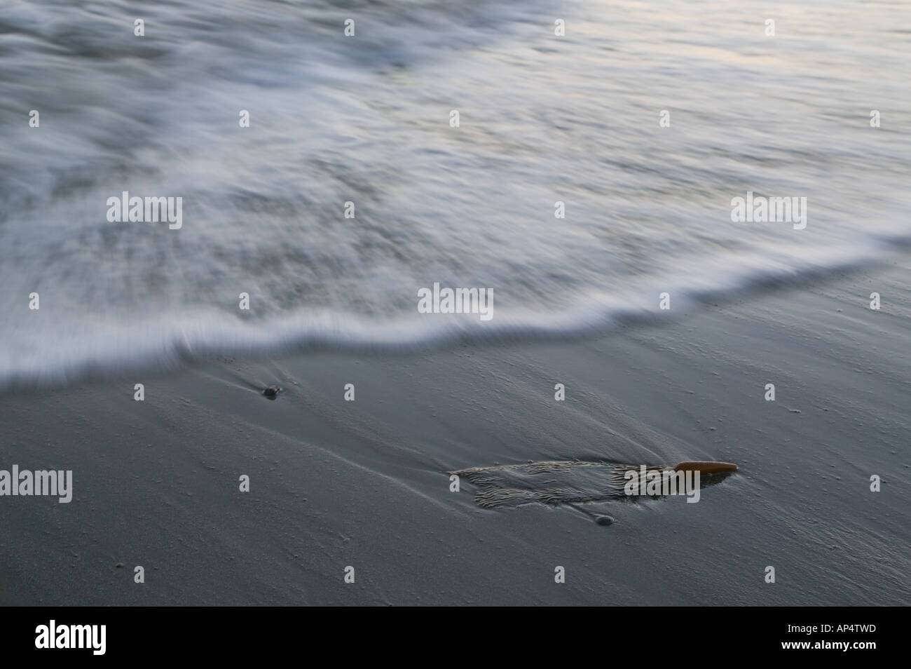 Water lapping onto rocks hi-res stock photography and images - Alamy