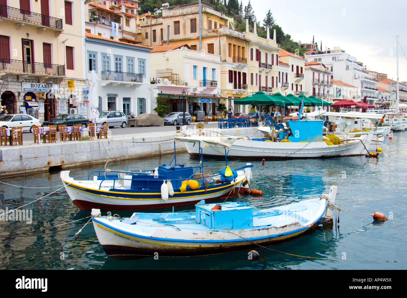Pastel colored buildings on the waterfront and colorful fishing boats ...
