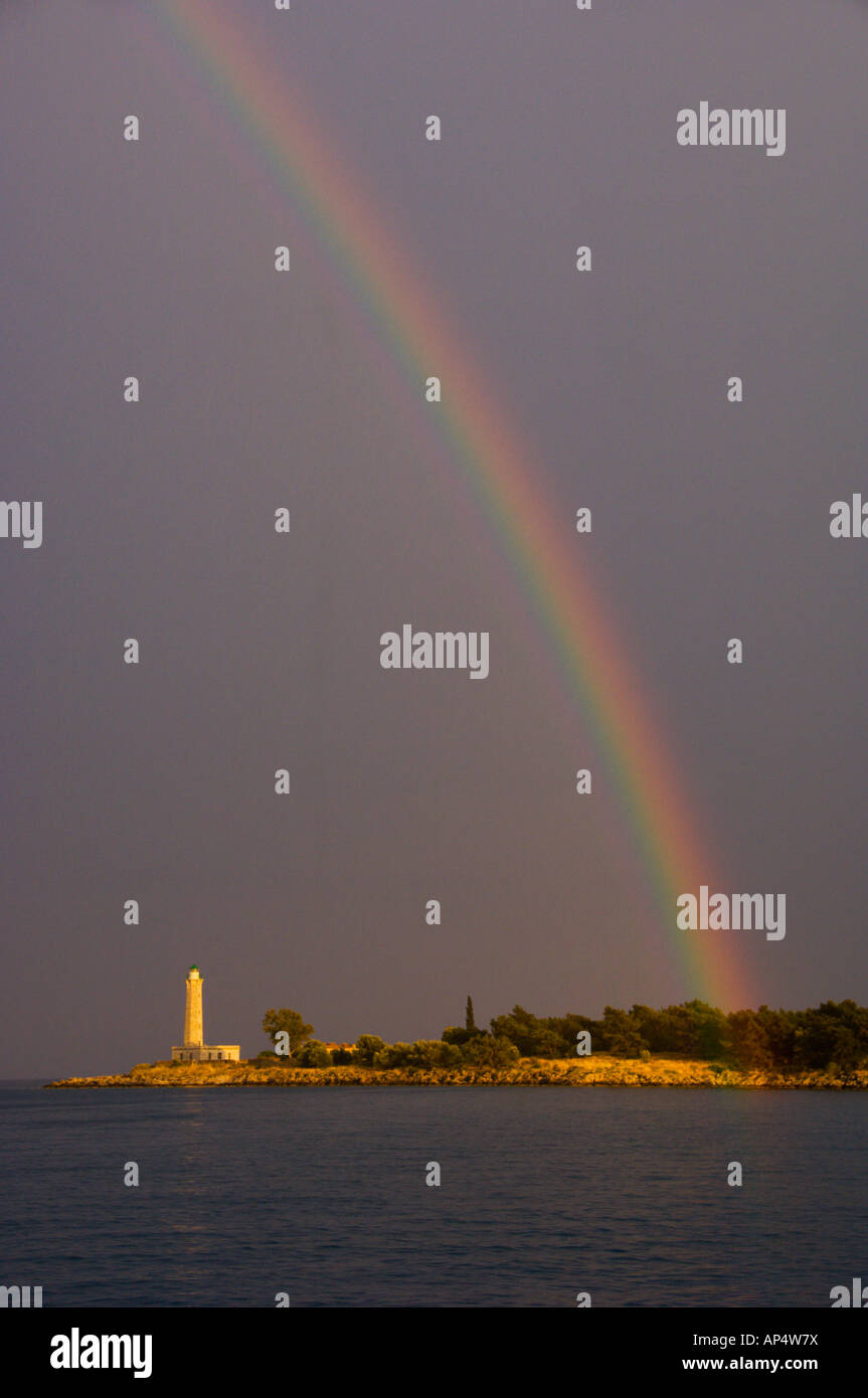 A rainbow with lighthouse at the fishing town of Githeo Greece Stock ...