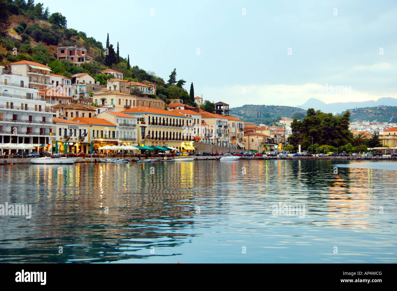 Pastel colored buildings on the waterfront and colorful fishing boats ...