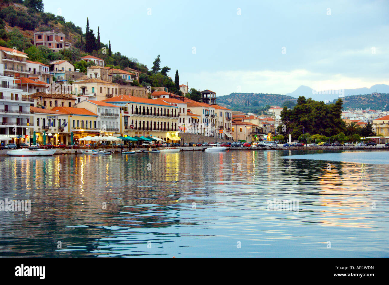 Pastel colored buildings on the waterfront and colorful fishing boats ...