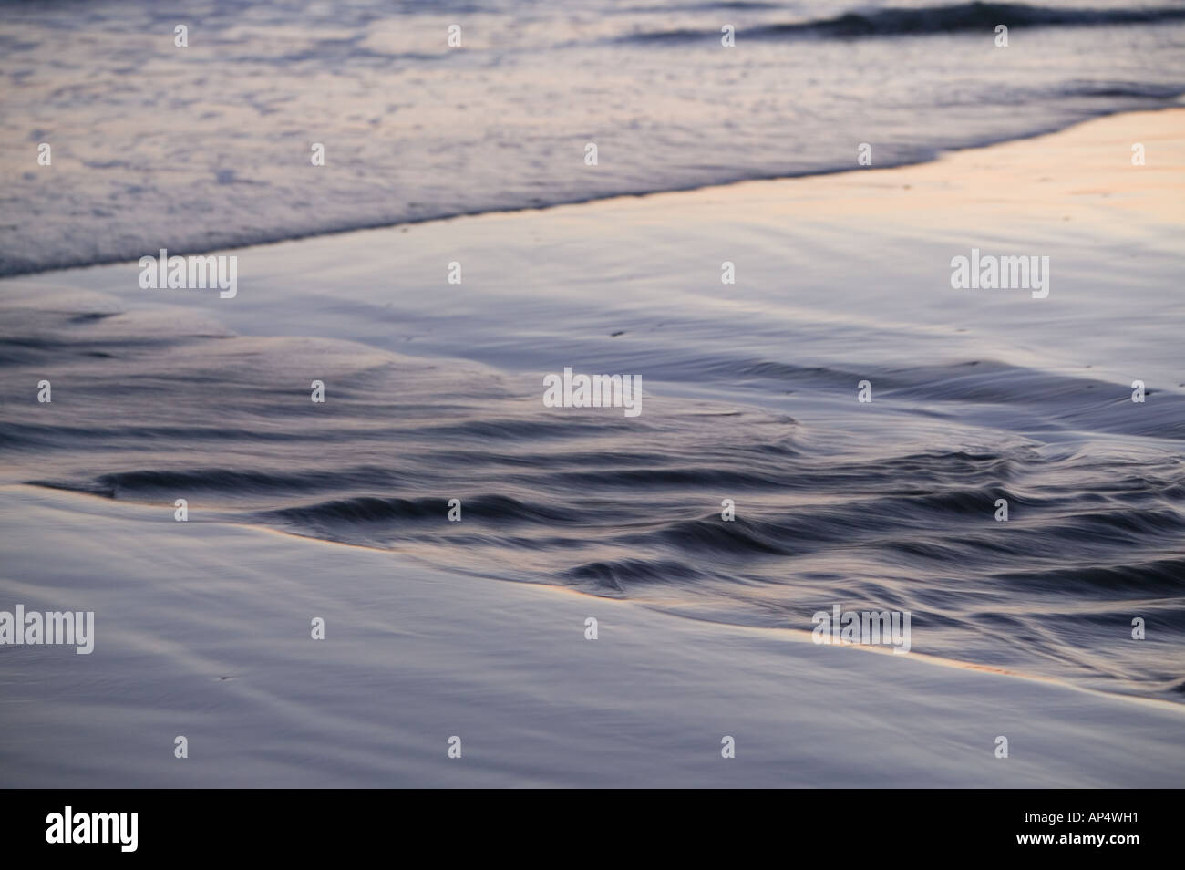 Water lapping onto rocks hi-res stock photography and images - Alamy