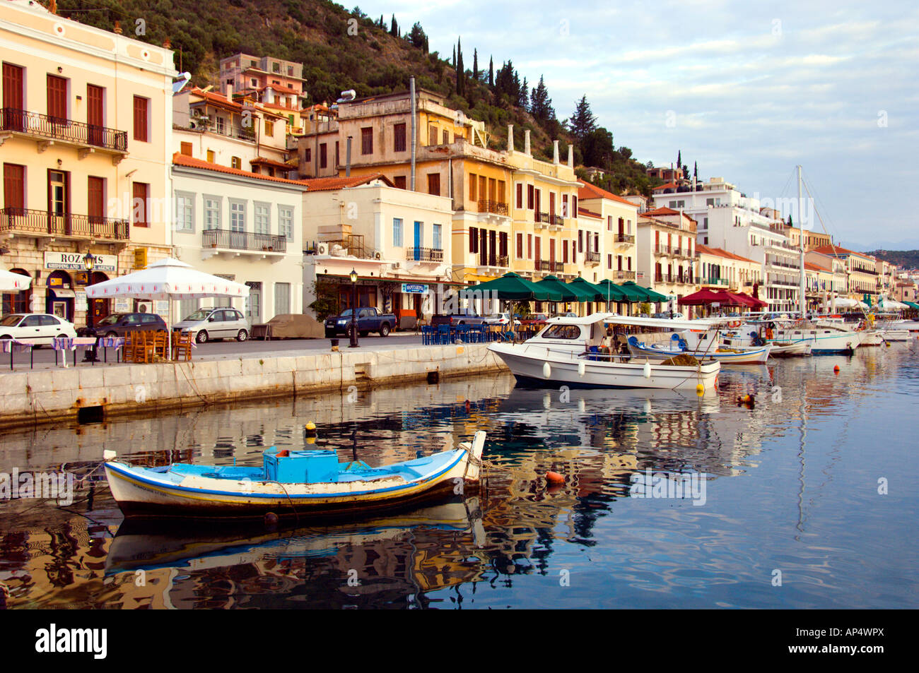 Pastel colored buildings on the waterfront and colorful fishing boats ...