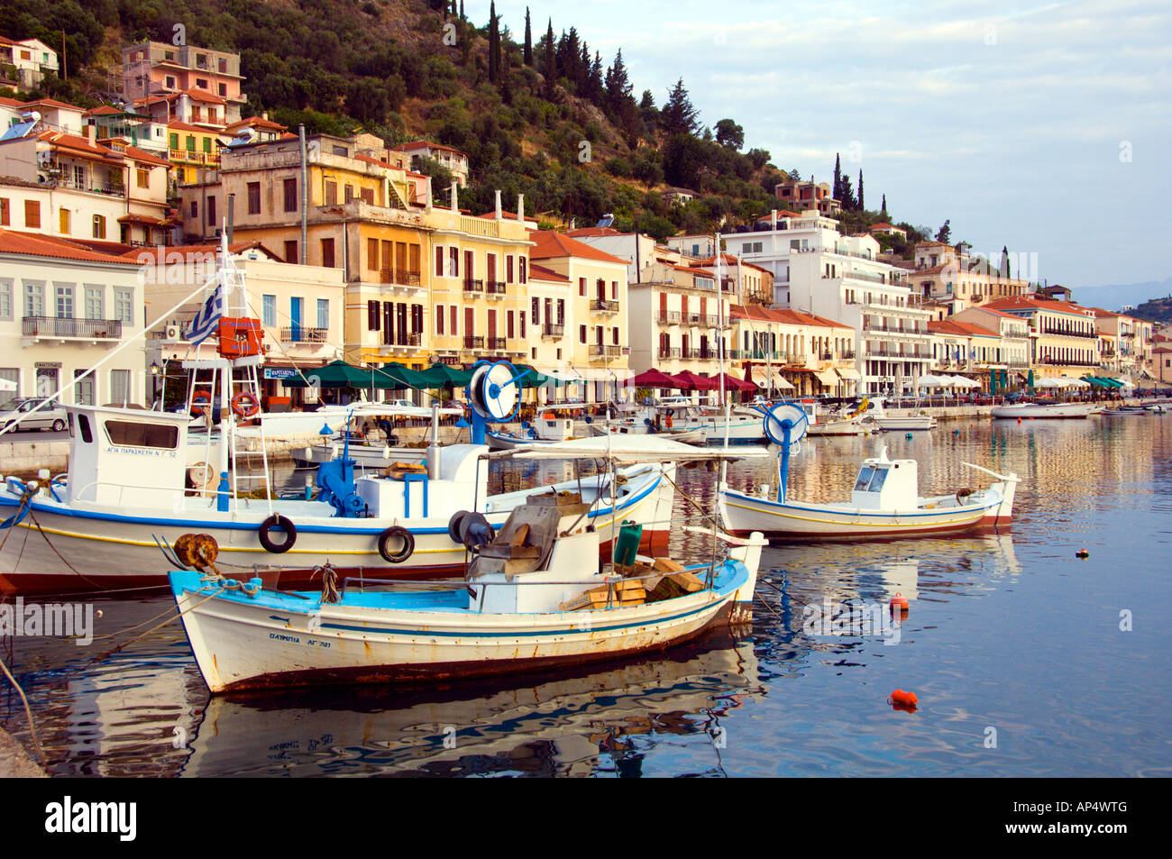 Pastel colored buildings on the waterfront and colorful fishing boats ...