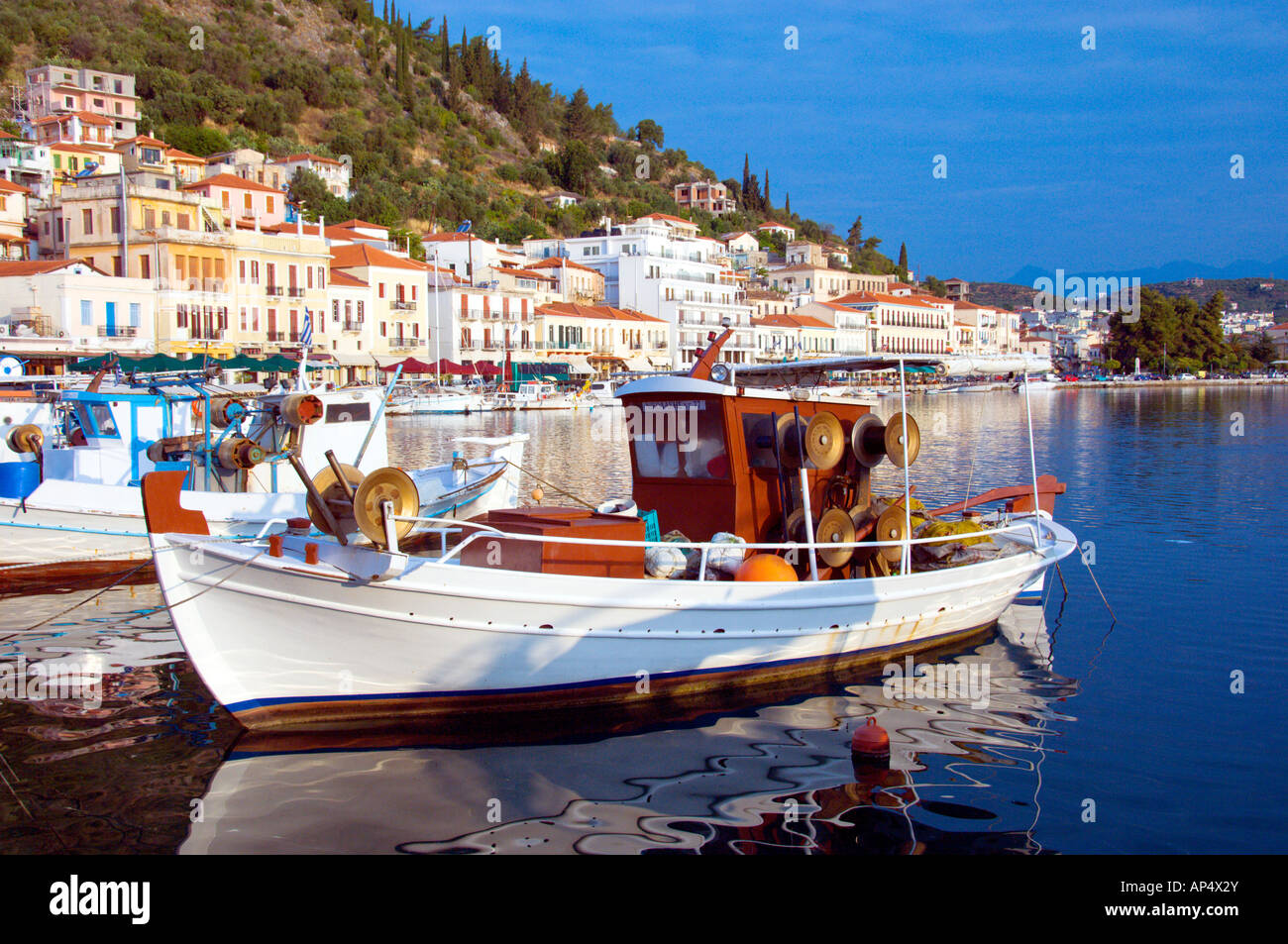 Pastel colored buildings on the waterfront and colorful fishing boats ...