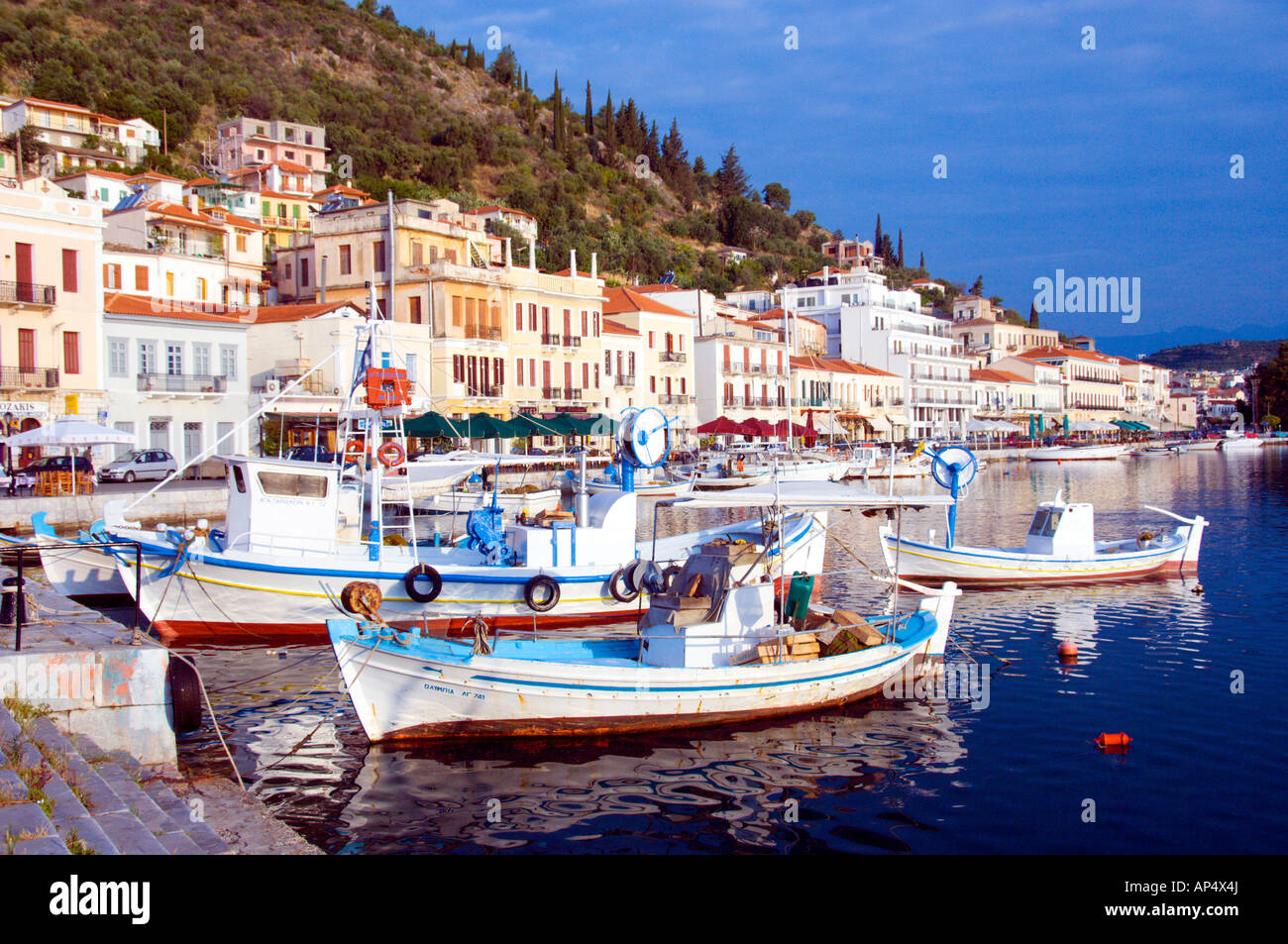 Pastel colored buildings on the waterfront and colorful fishing boats ...