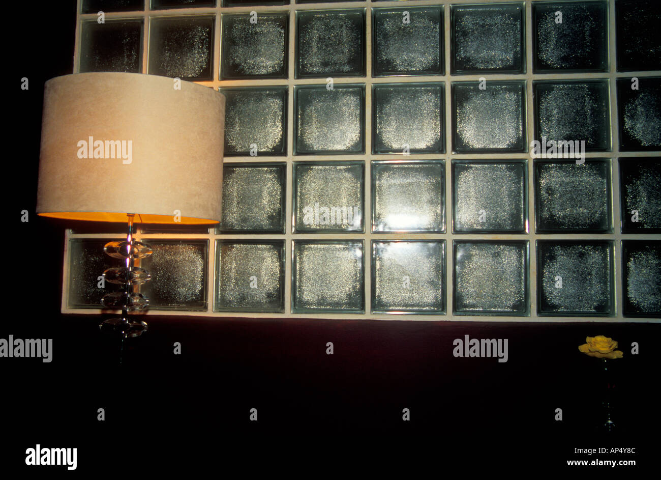 Lamp by the side of a glass wall Stock Photo - Alamy