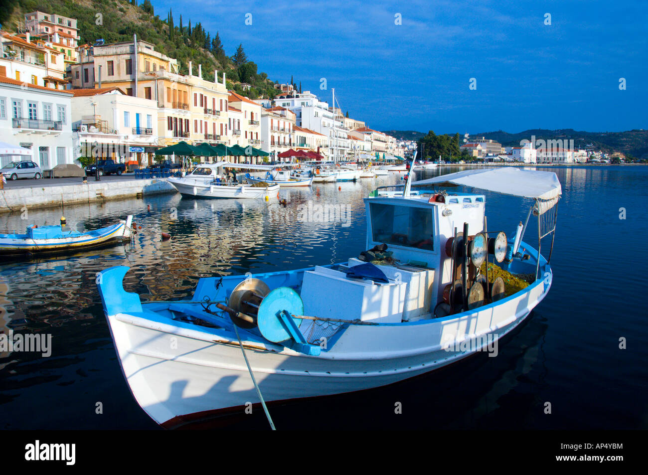 Pastel colored buildings on the waterfront and colorful fishing boats ...