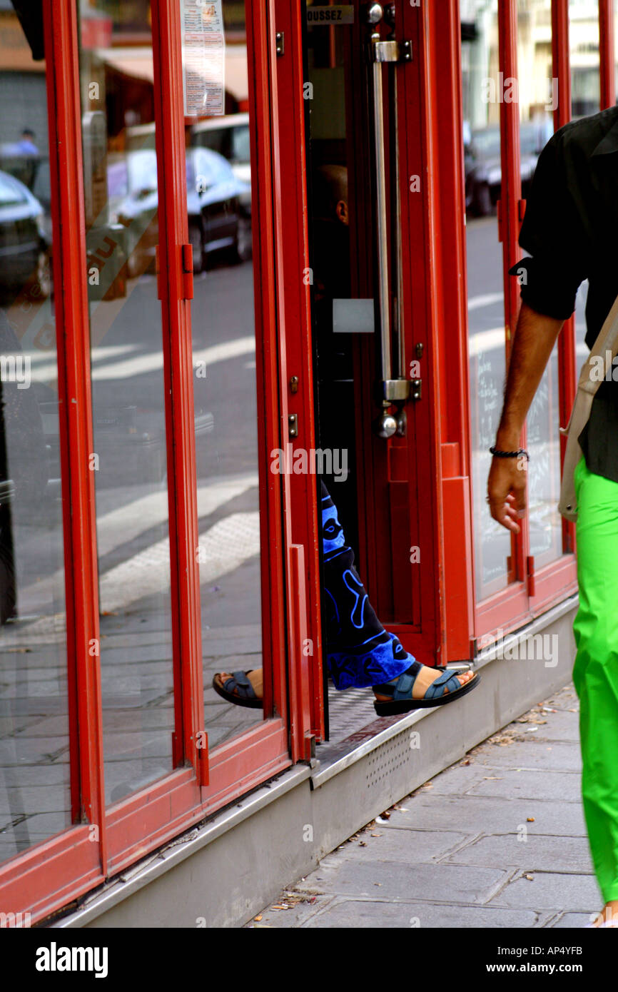 Girl steps out of the restaurant Stock Photo - Alamy