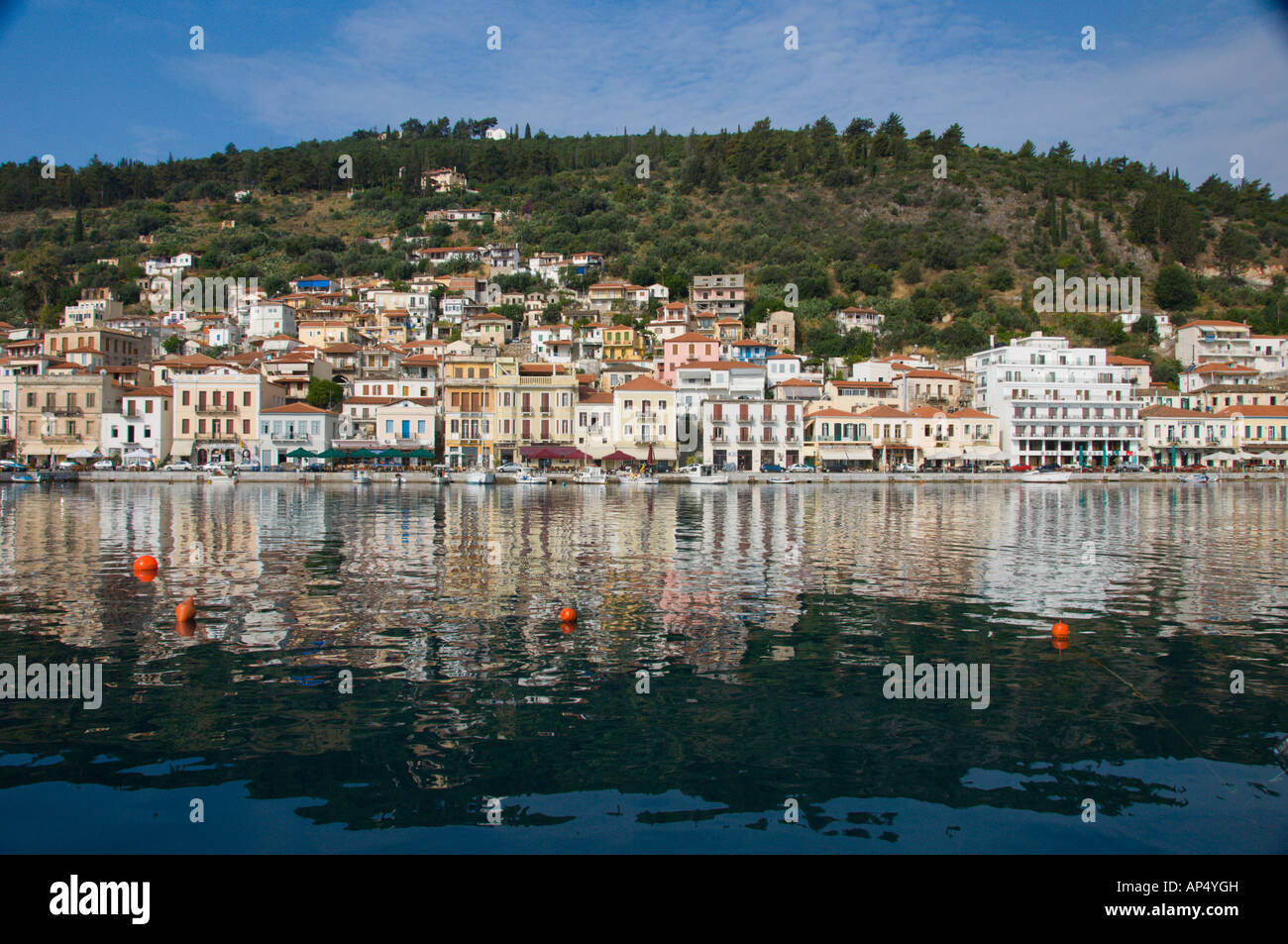 Pastel colored buildings on the waterfront and colorful fishing boats ...