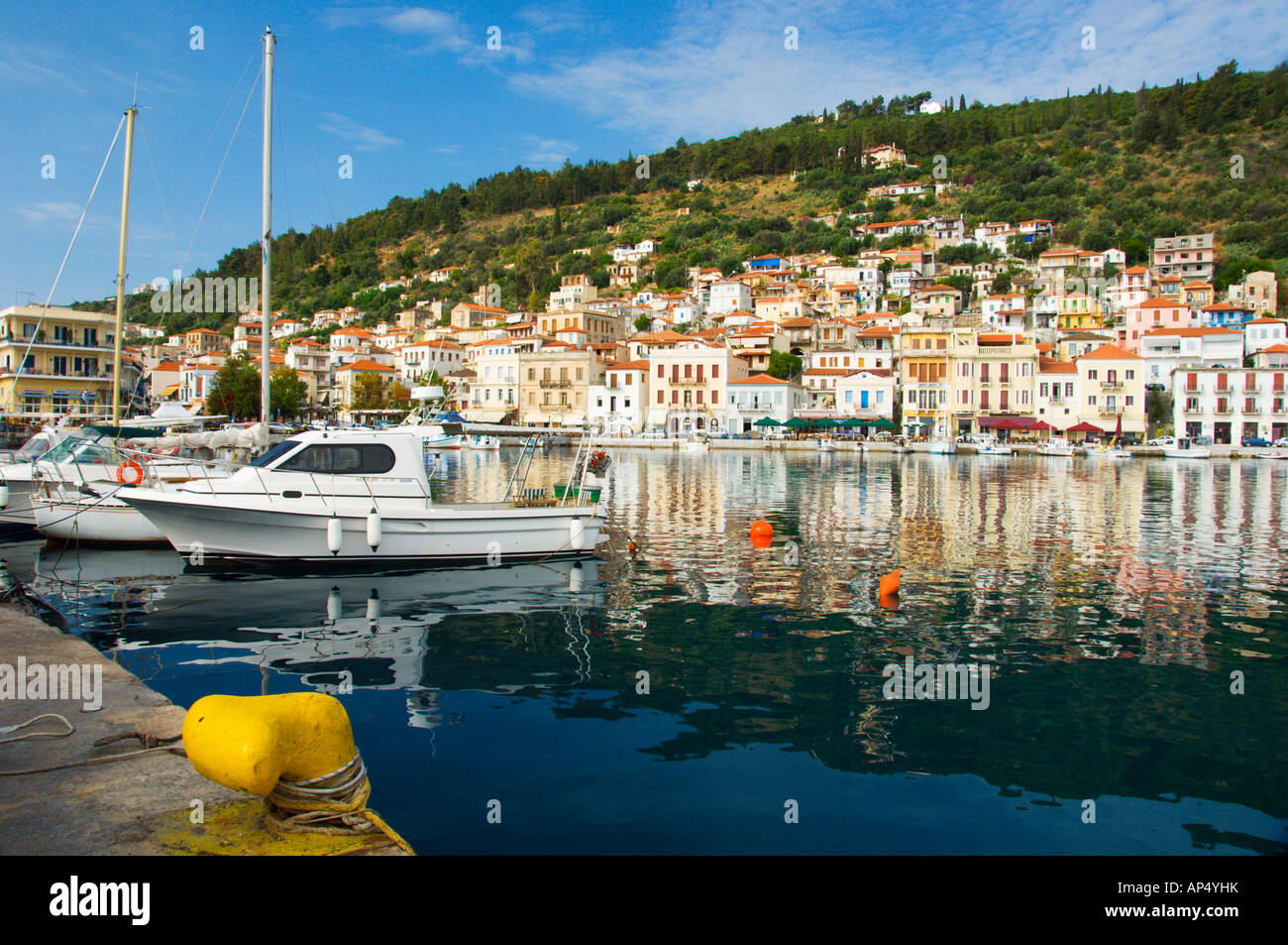Pastel colored buildings on the waterfront and colorful fishing boats ...