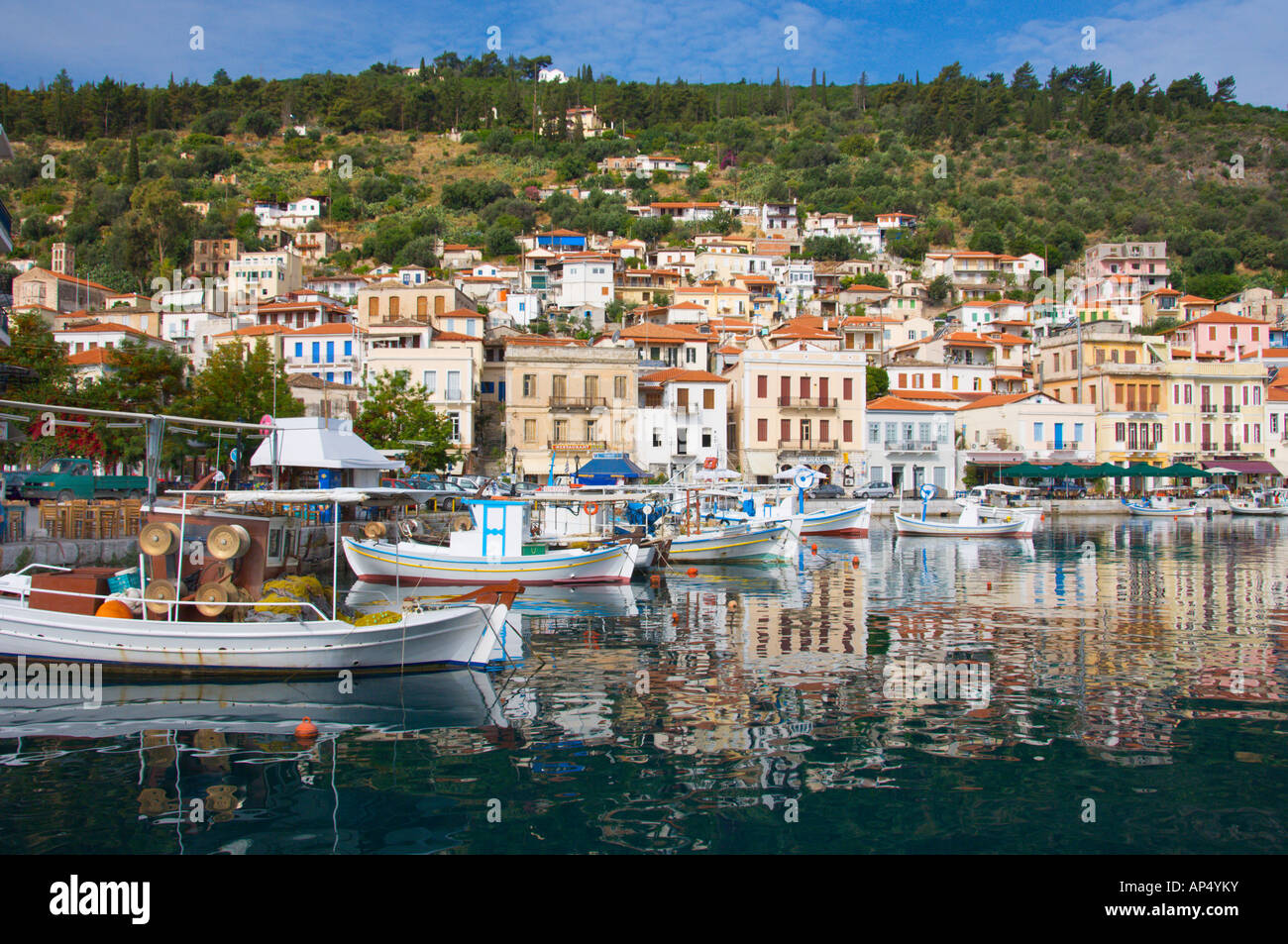 Pastel colored buildings on the waterfront and colorful fishing boats ...