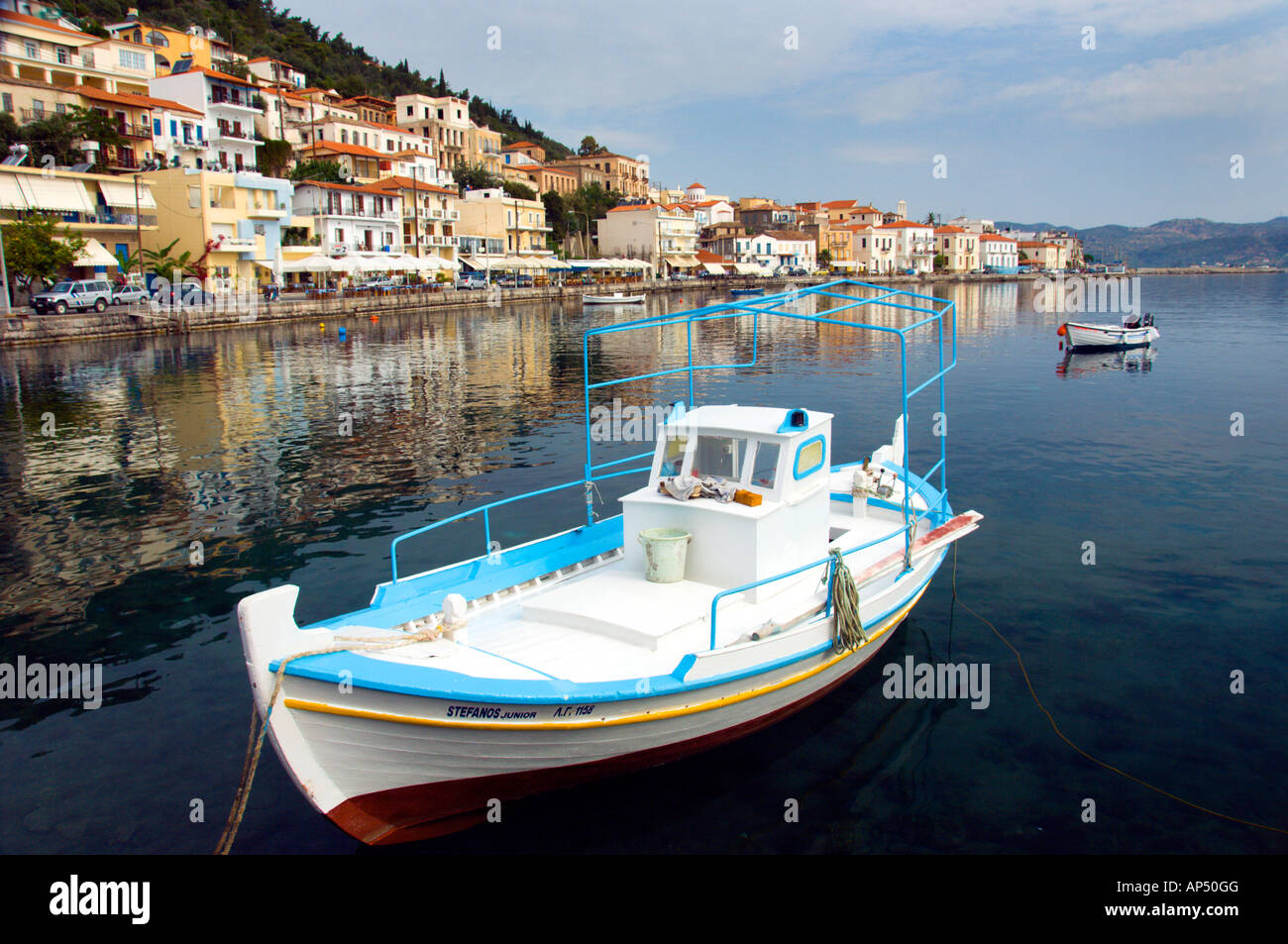 Pastel colored buildings on the waterfront and colorful fishing boats ...