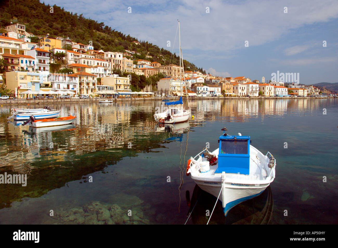 Pastel colored buildings on the waterfront and colorful fishing boats ...