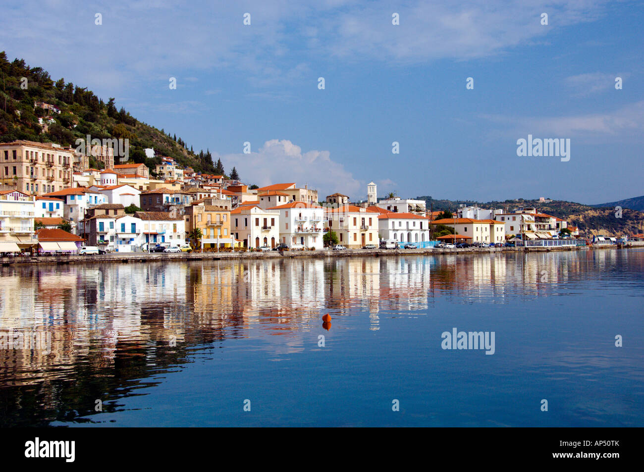Pastel colored buildings on the waterfront and colorful fishing boats ...