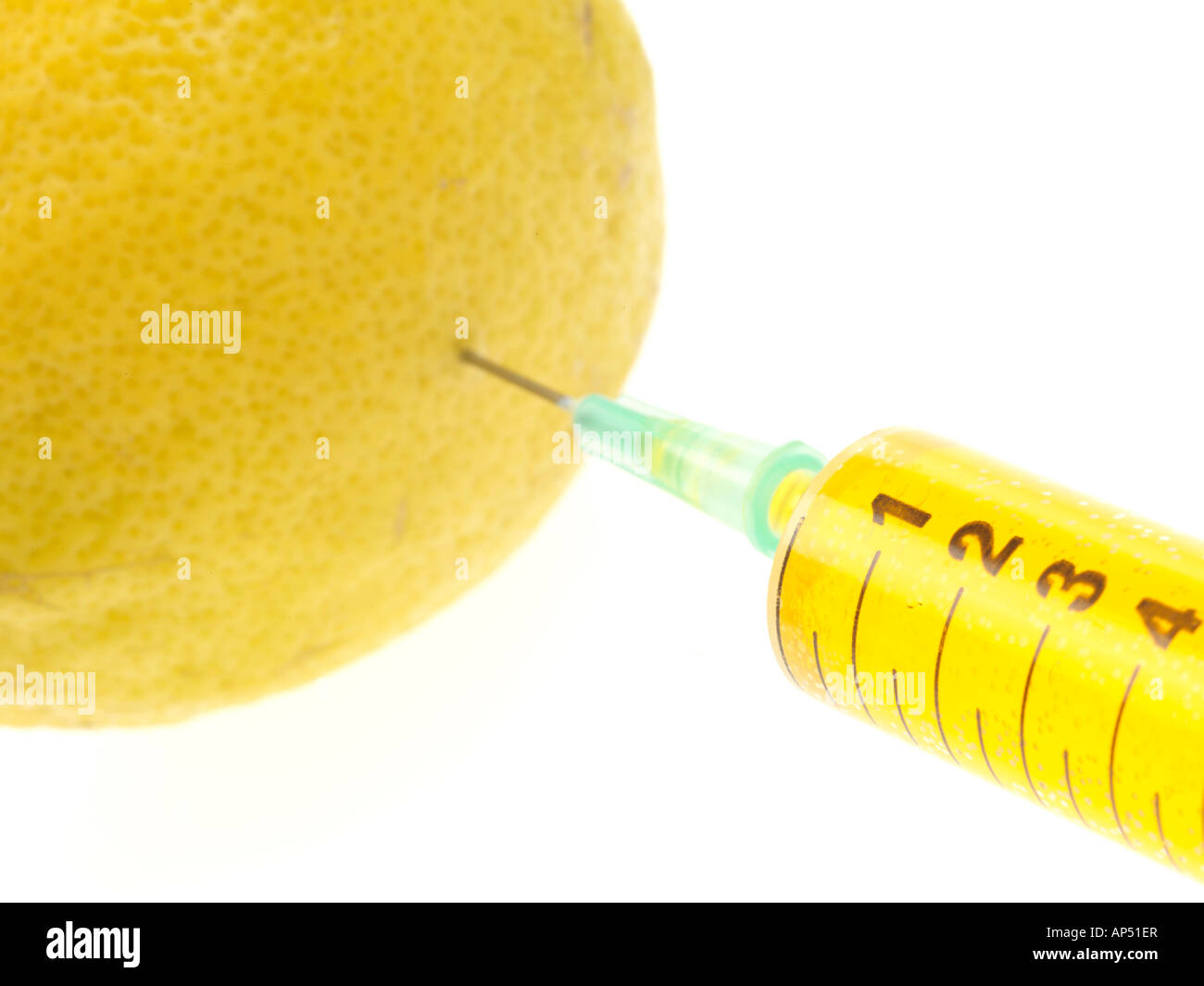 Injecting a Lemon Stock Photo - Alamy