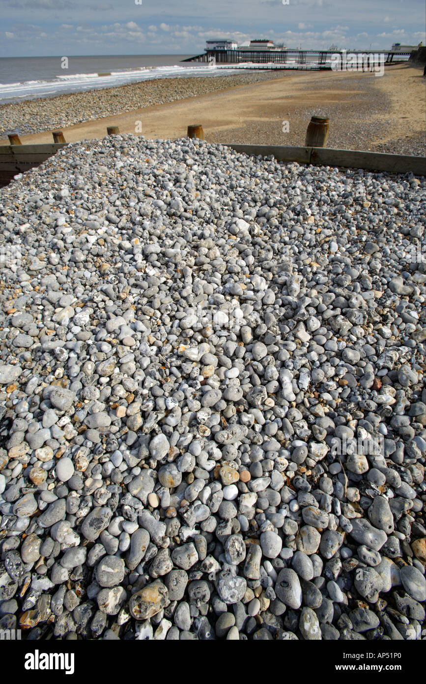 Beach Shingle and Distant Pier Cromer Stock Photo - Alamy
