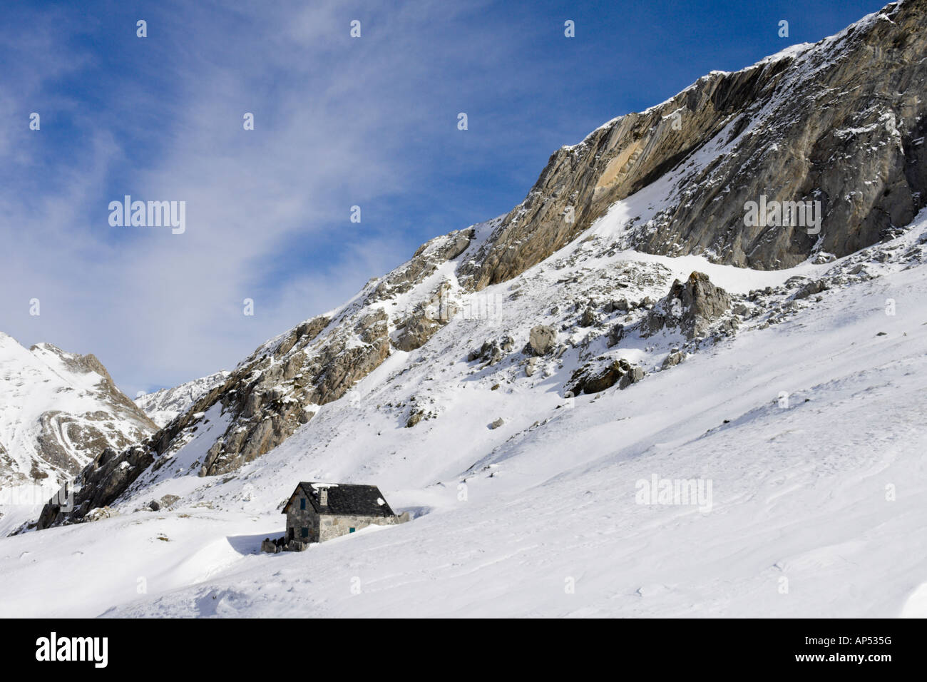 Beautiful little house high in the mountain, covered with snow Stock ...