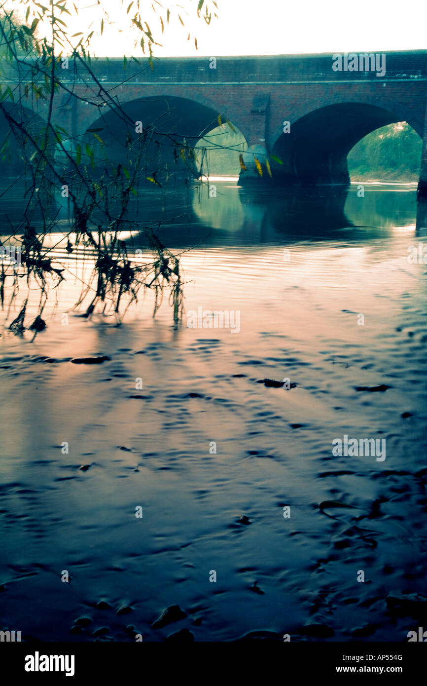 Arched road bridge over a river Stock Photo - Alamy