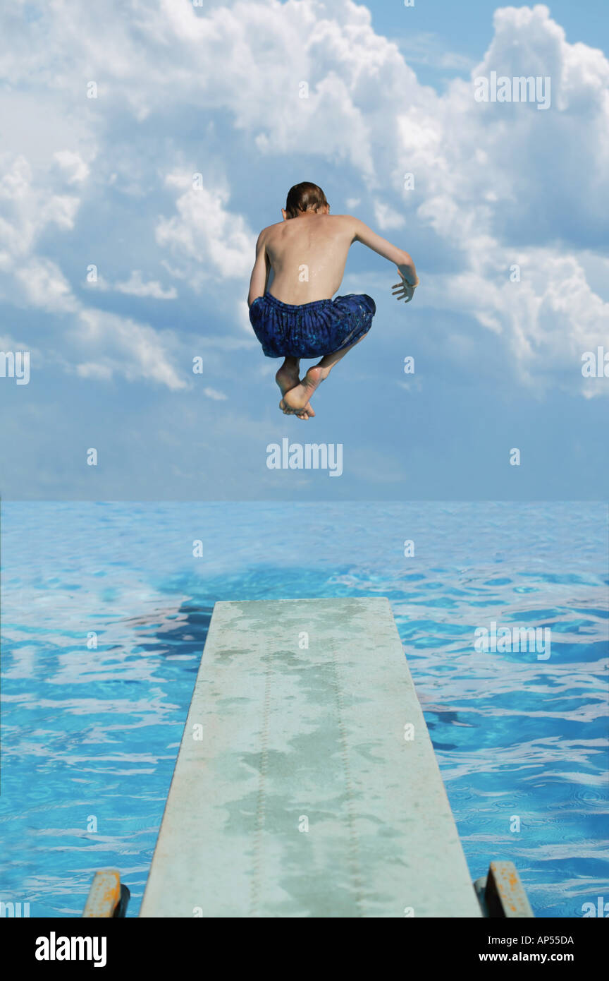 Boy jumping swimming pool back view hi-res stock photography and images ...