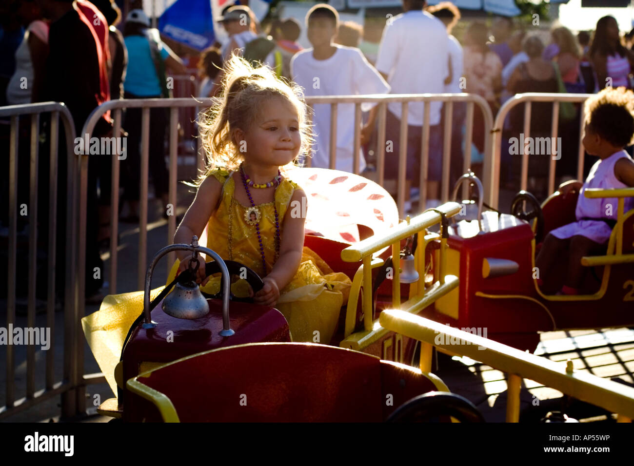 a young girl enjoying herself on a ride at Coney Island Stock Photo - Alamy