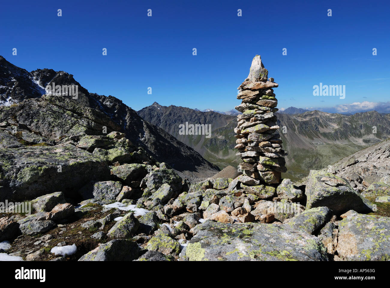 Stone man used as signpost along a hiking trail, Alps, Switzerland ...