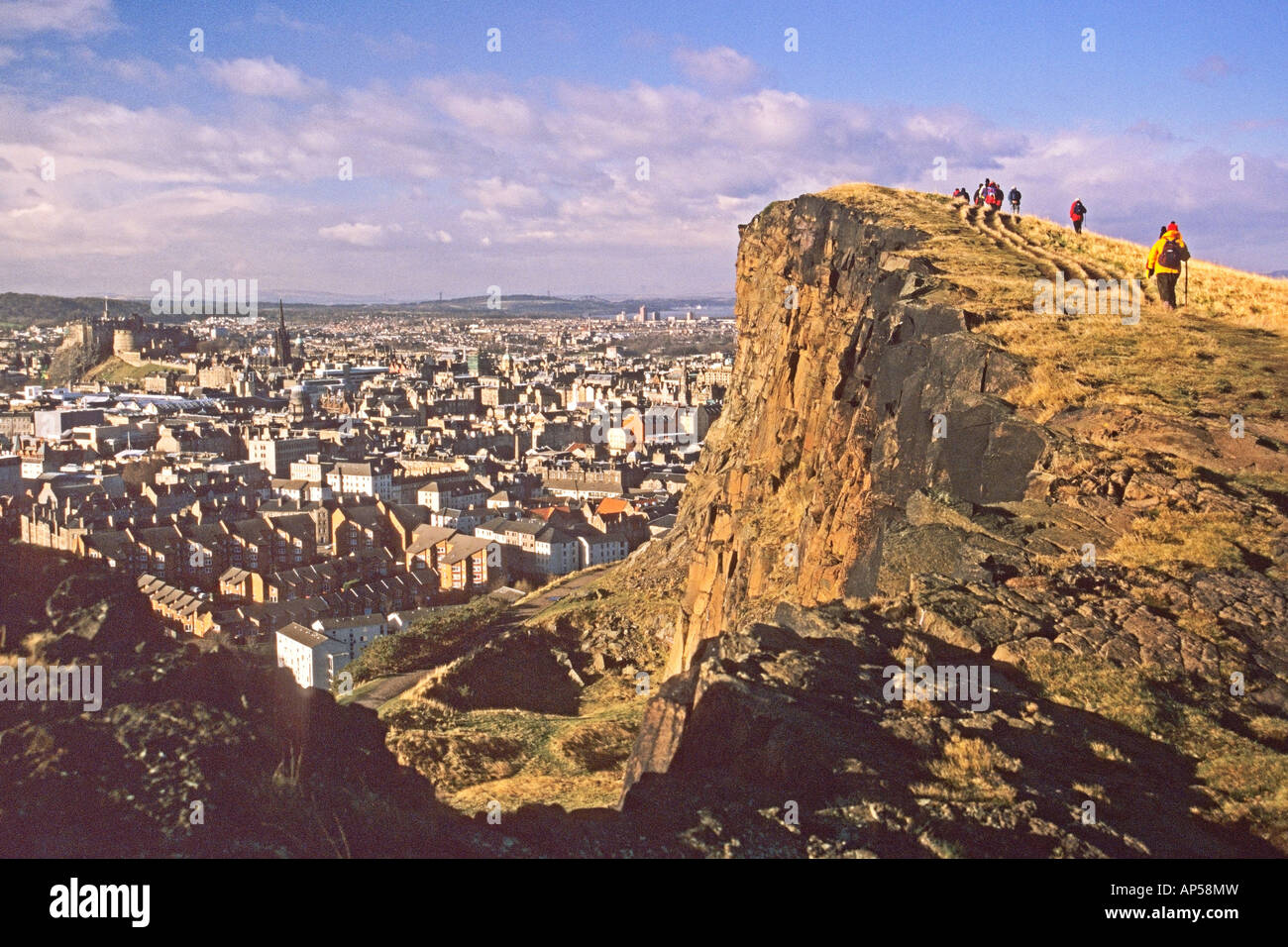 A rambling club walking over Salisbury Crags in Holyrood Park in ...