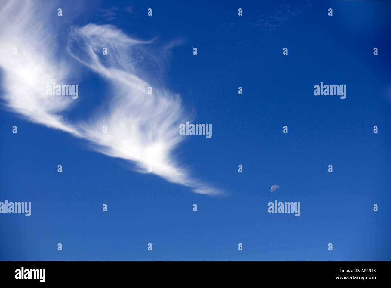 Cirrus Cloud Formation With Moon Stock Photo - Alamy
