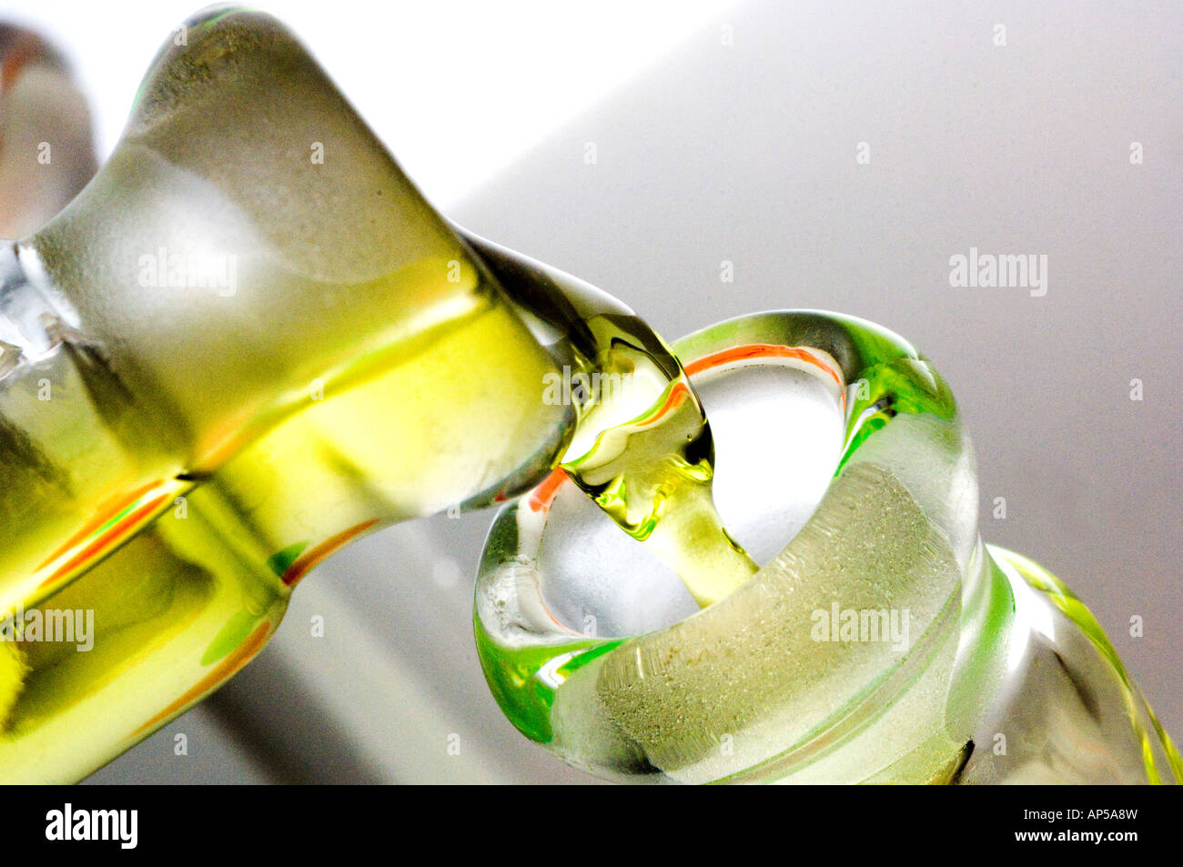 Closeup of liquid pouring into glass beaker in research laboratory ...
