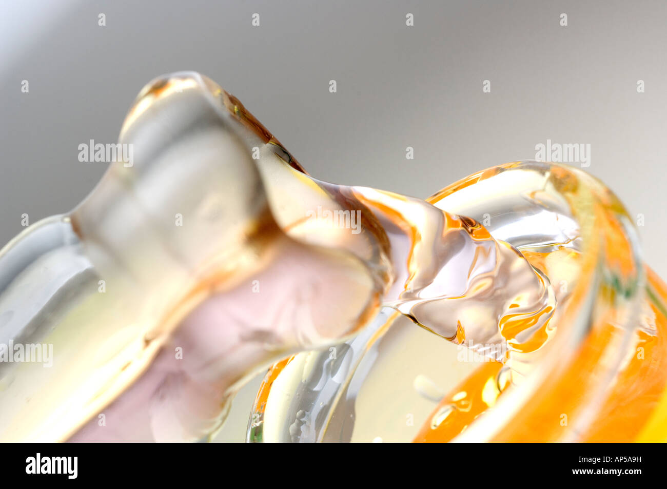 Closeup of liquid pouring from laboratory flask into glass beaker Stock ...