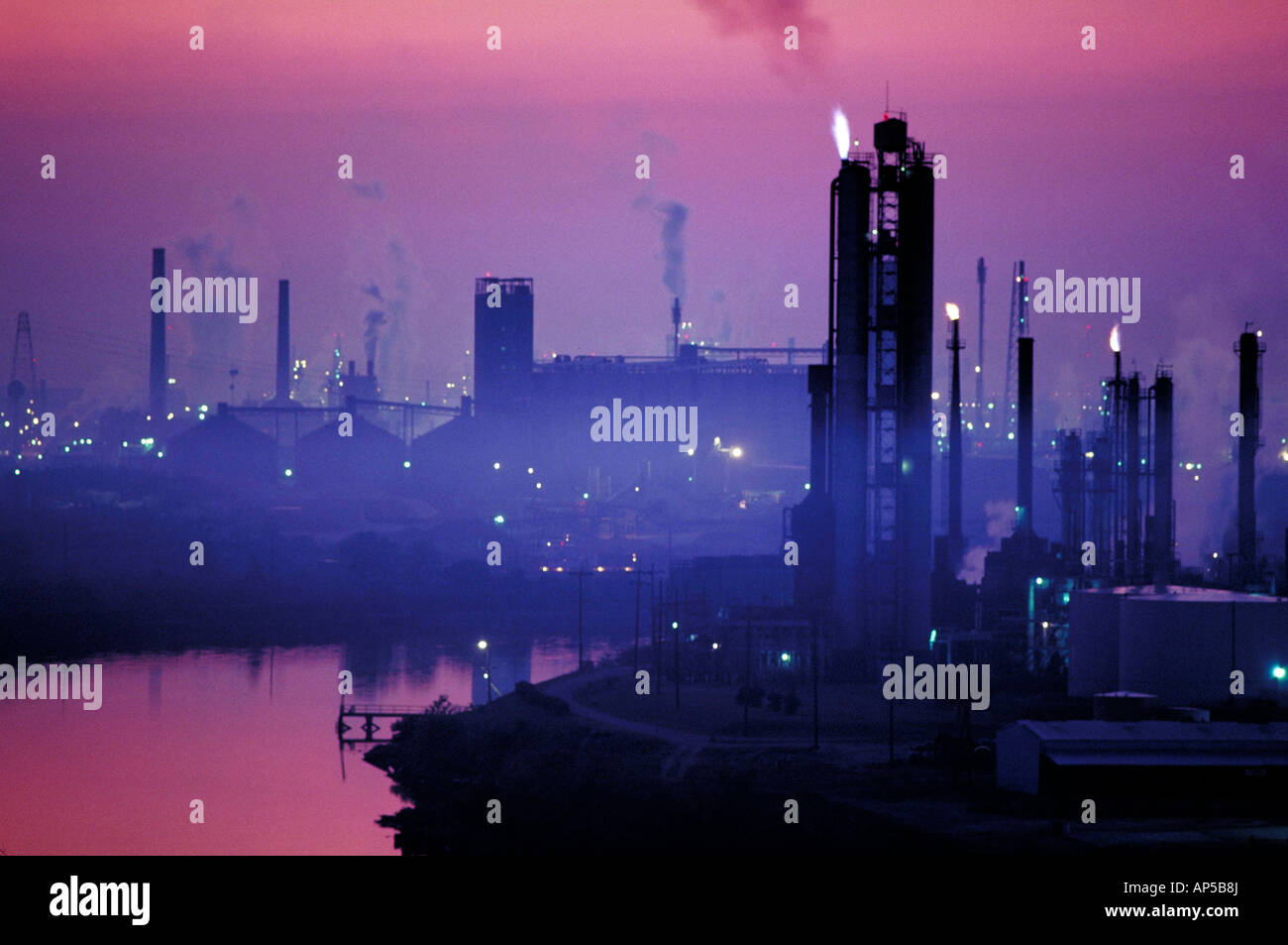 Smog shrouds a Houston oil refinery Houston Texas Stock Photo - Alamy