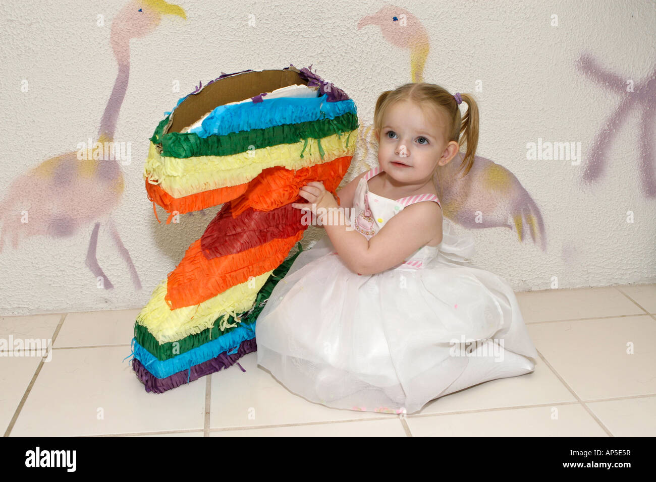 Blond Female Child Toddler Model with Large Number 2 Stock Photo - Alamy