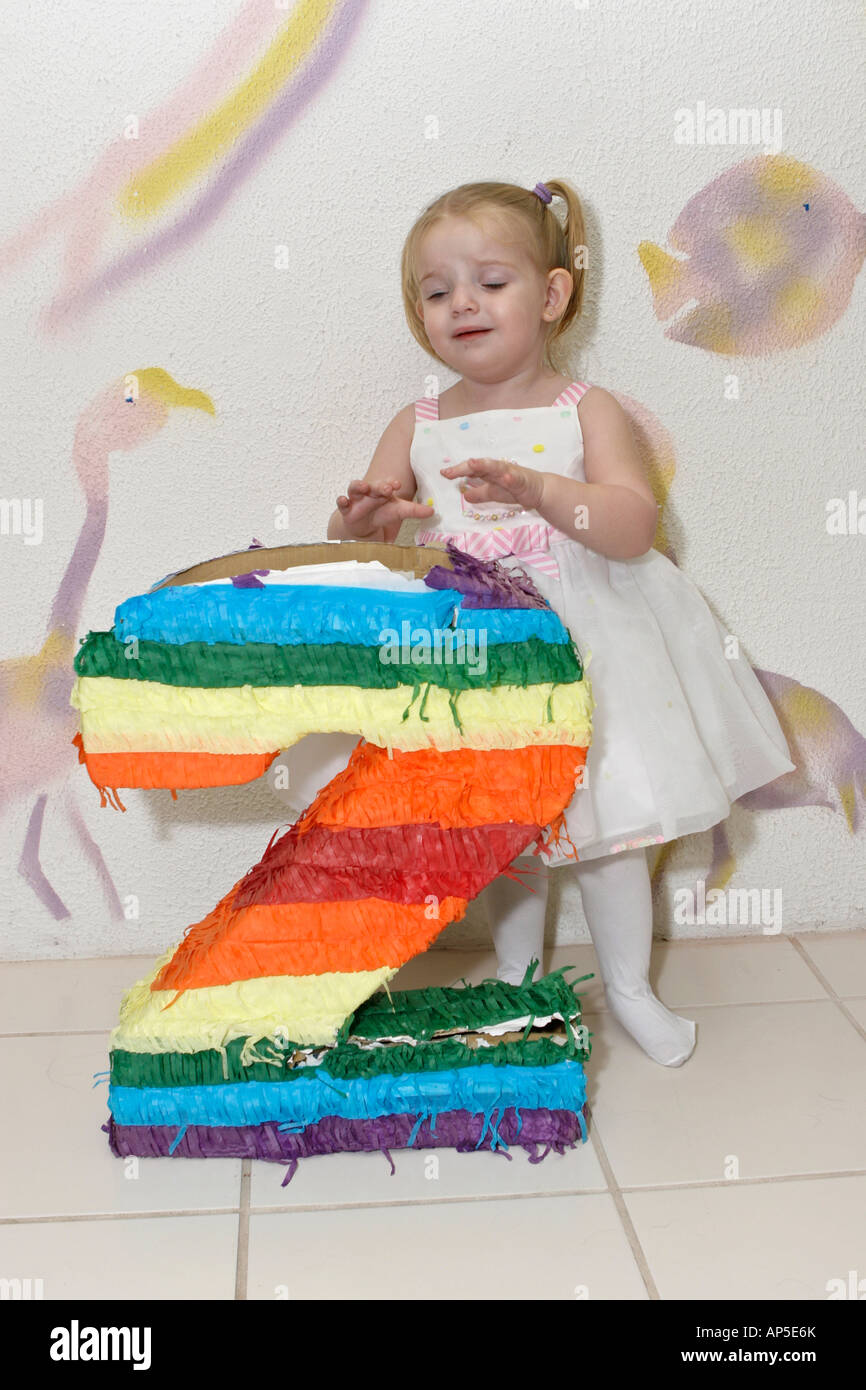 Blond Female Child Toddler Model with Large Number 2 Stock Photo - Alamy