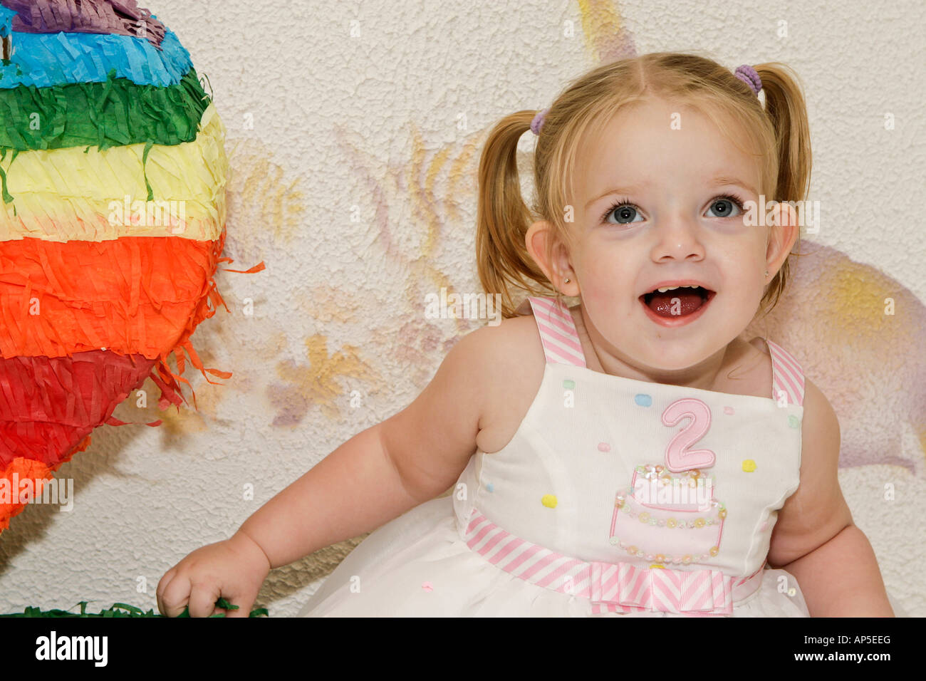 Blond Female Child Toddler Model with Large Number 2 Stock Photo - Alamy