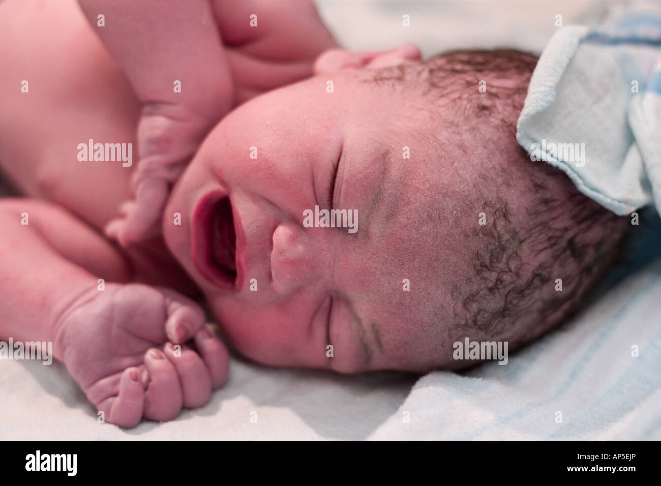 Newborn baby boy crying in delivery room Stock Photo - Alamy