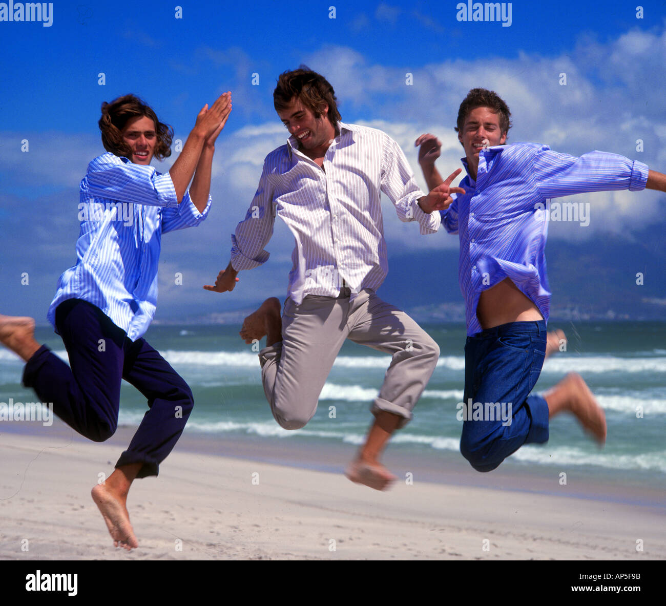 blokes on beach Stock Photo - Alamy