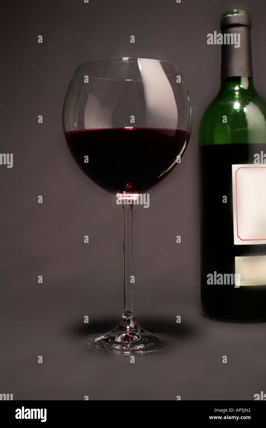 Glass Of Red Wine With Bottle, Soft Focus, Black Background Stock Photo ...