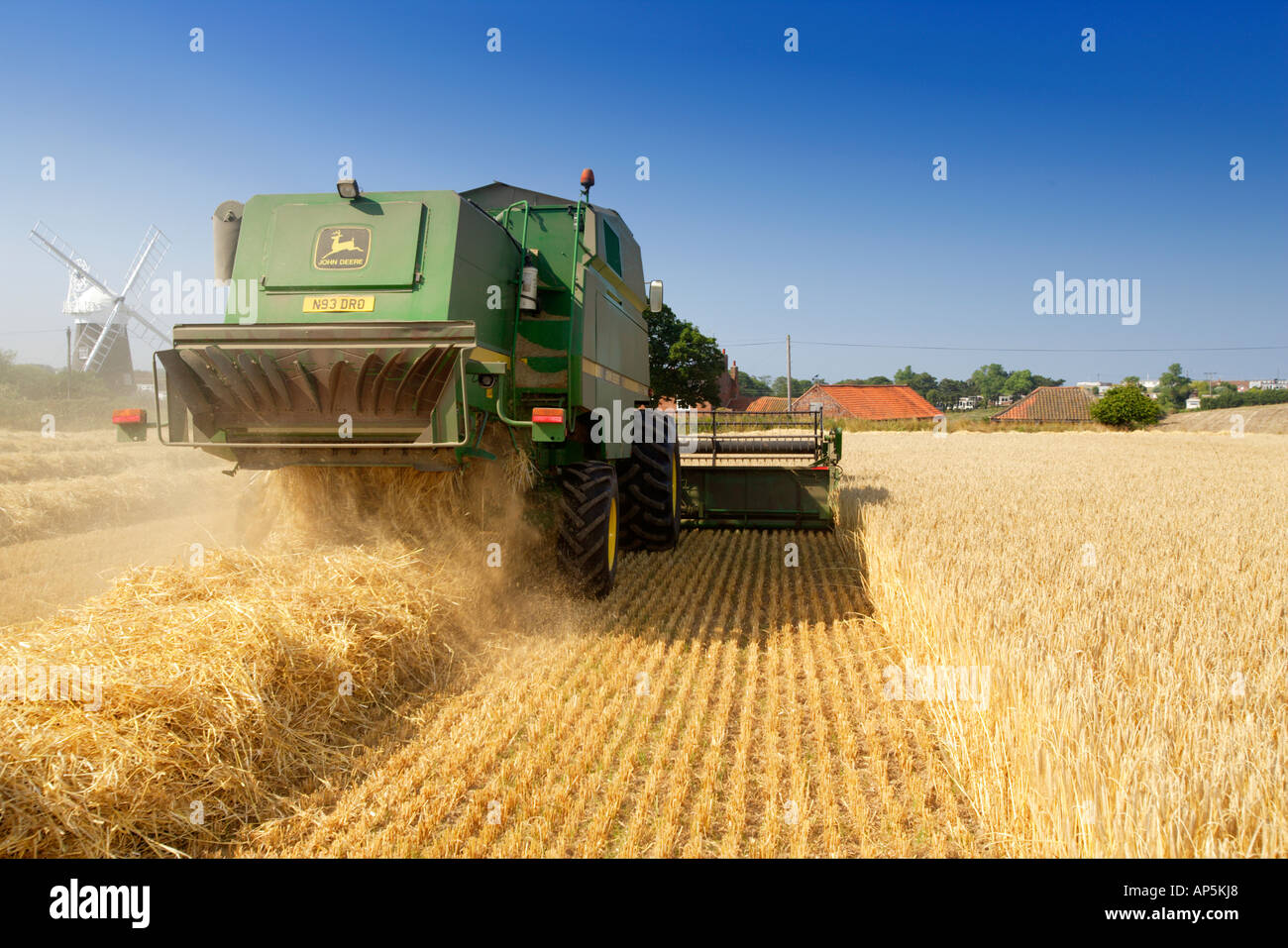John Deere Combine Harvester With Tractor And Trailer Barley Harvesting ...