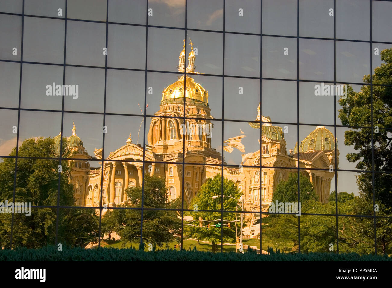 A reflected and distorted view of the capitol building in Des Moines ...