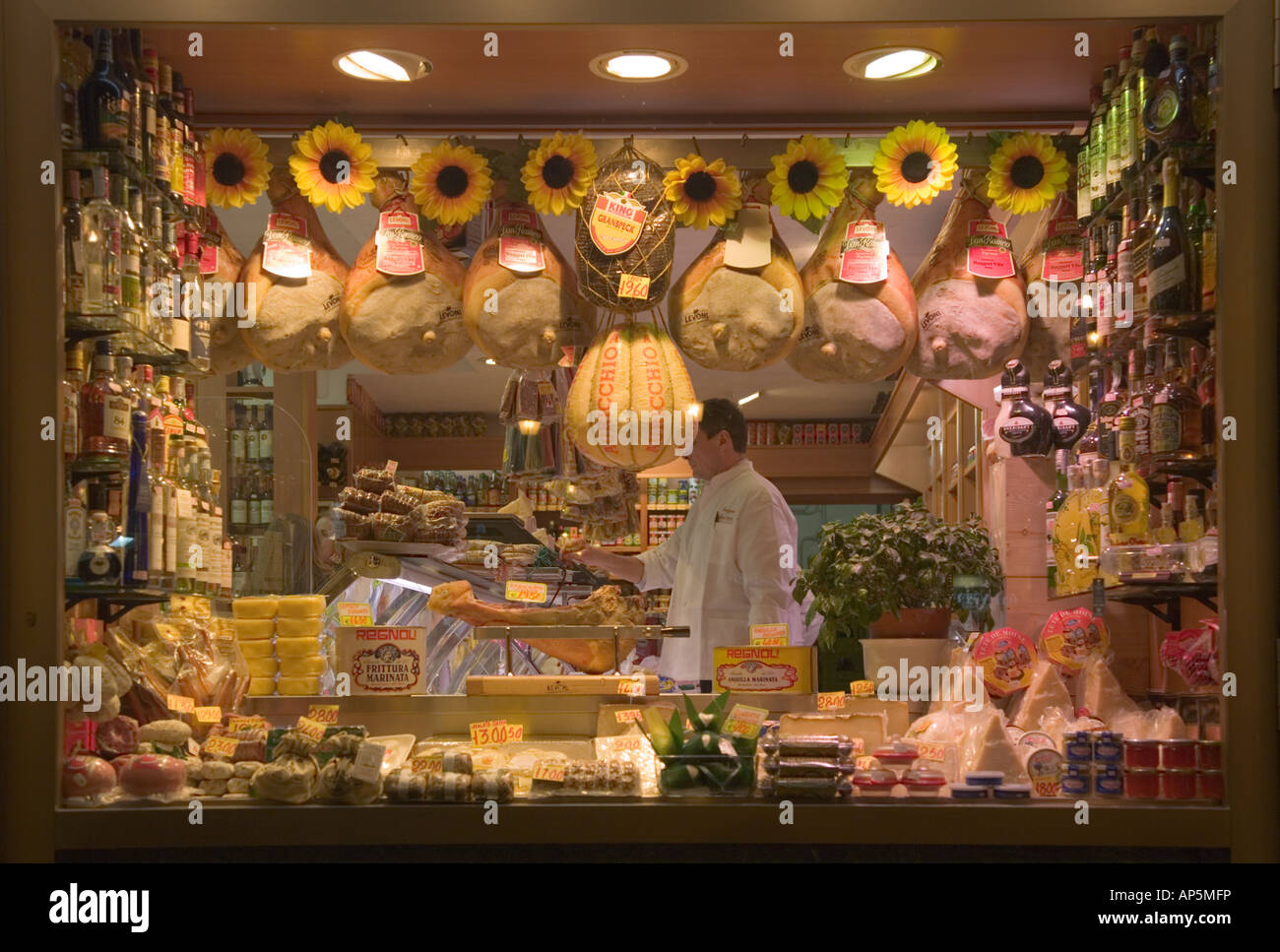Illuminated shop window of a delicatessen shop at night Rome Italy ...
