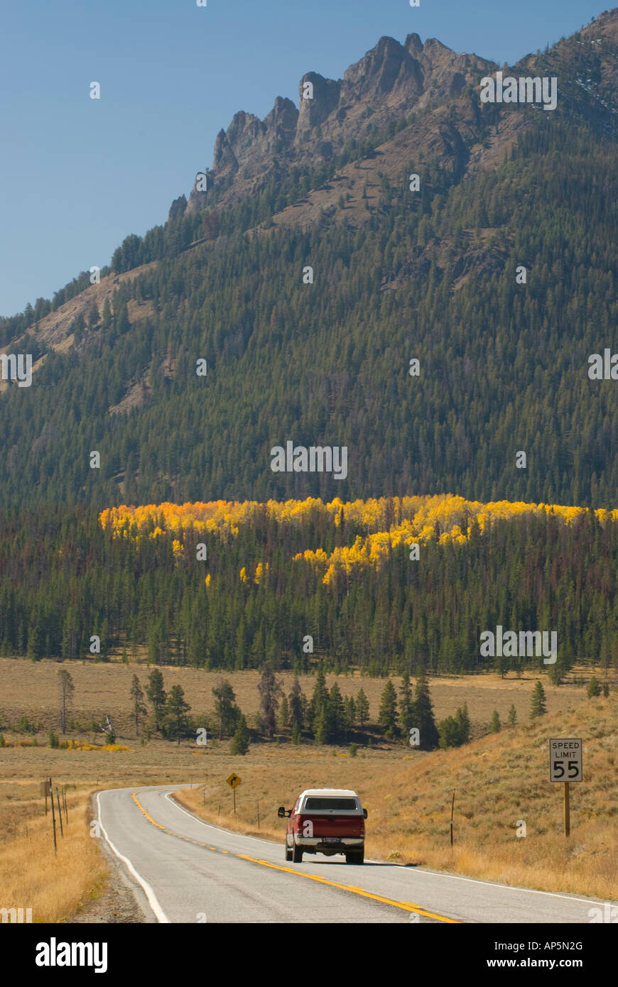 Idaho, Sawtooth Scenic Byway. A car travel down the highway on a ...