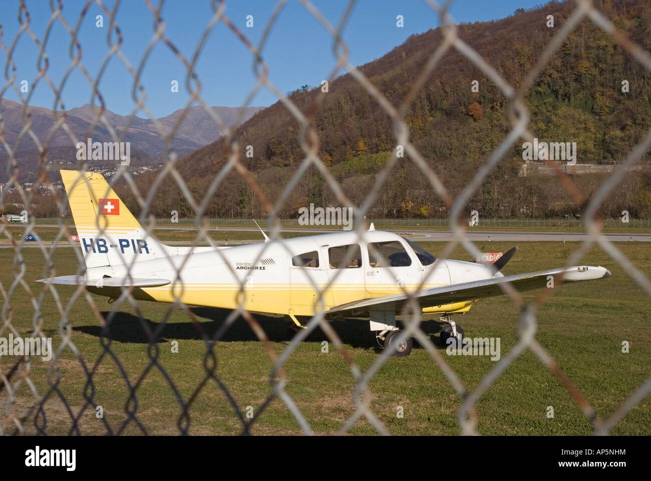small airplane behind the net Stock Photo - Alamy