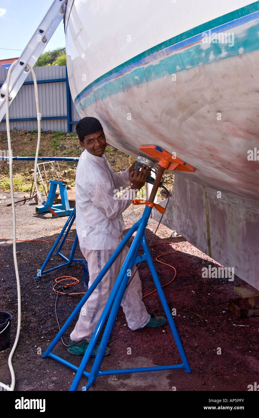 Young local man at work in a boatyard, Curacao Stock Photo - Alamy