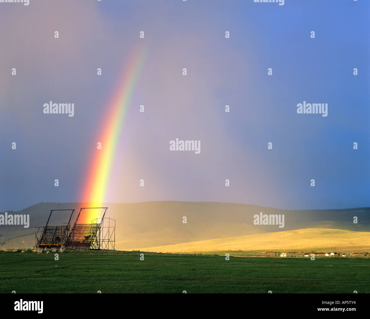 A beaverslide haystacker with full rainbow in the Big Hole Valley near ...